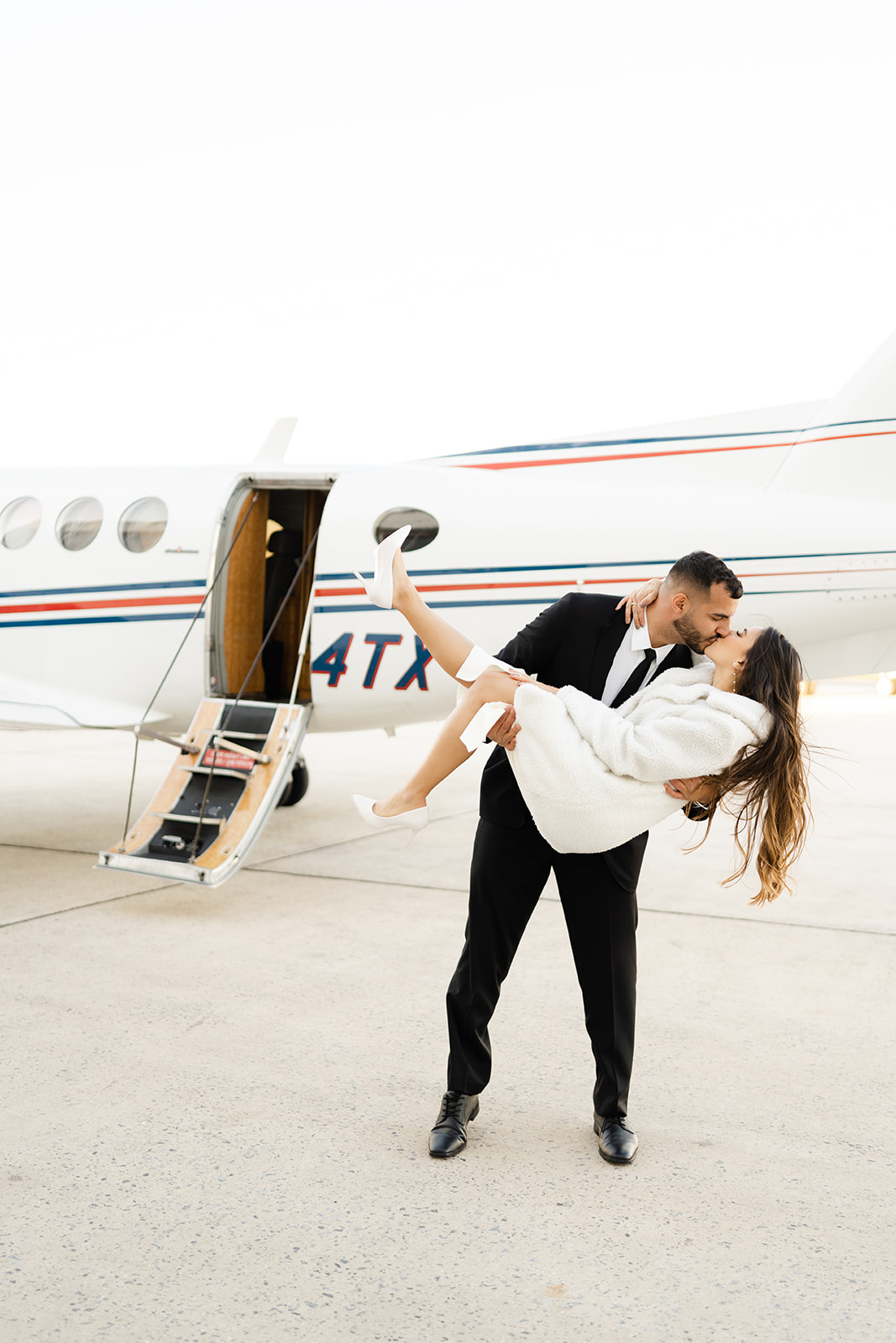 An Epic Private Jet Glam Photoshoot Engagement Session